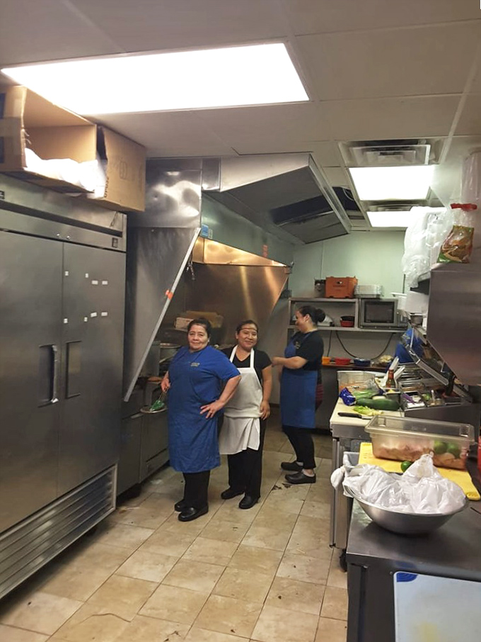 Where the magic happens! The kitchen crew works their culinary alchemy, transforming simple ingredients into dishes that haunt your dreams. 