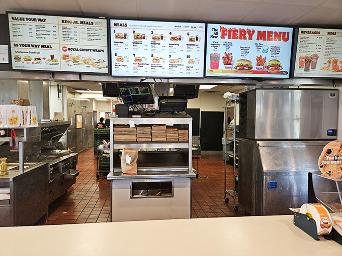 The engine room where burger magic happens. Spotless stainless steel and organized chaos—the hallmarks of a serious food operation.