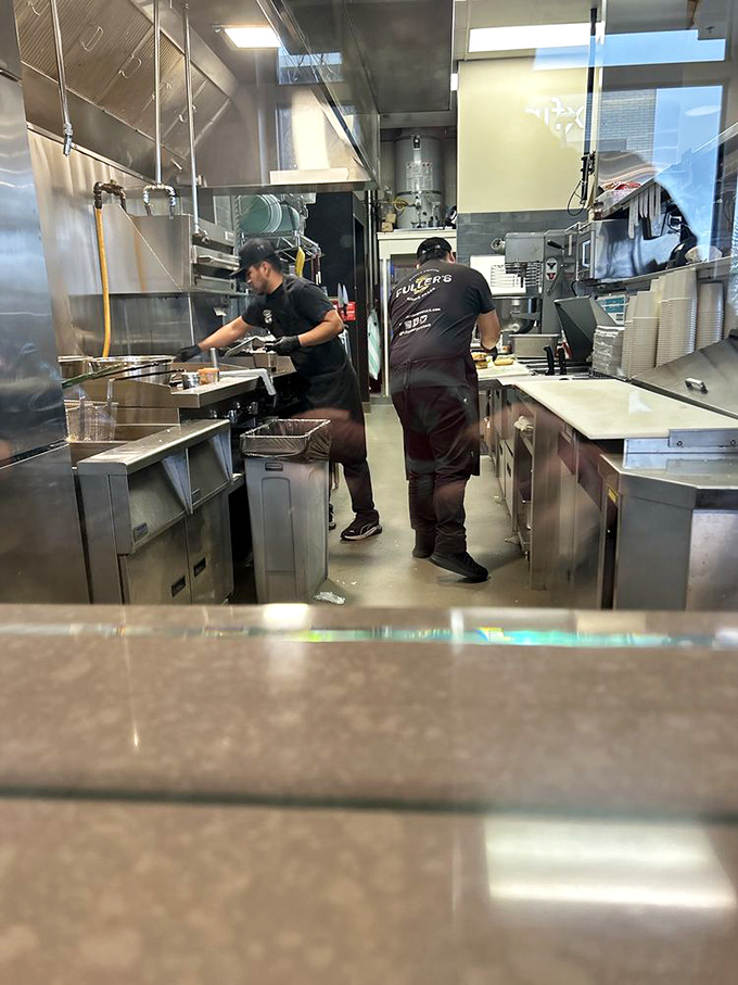 The kitchen crew moves with the choreographed precision of a ballet, if ballets were about creating burger perfection instead of telling swan stories. 