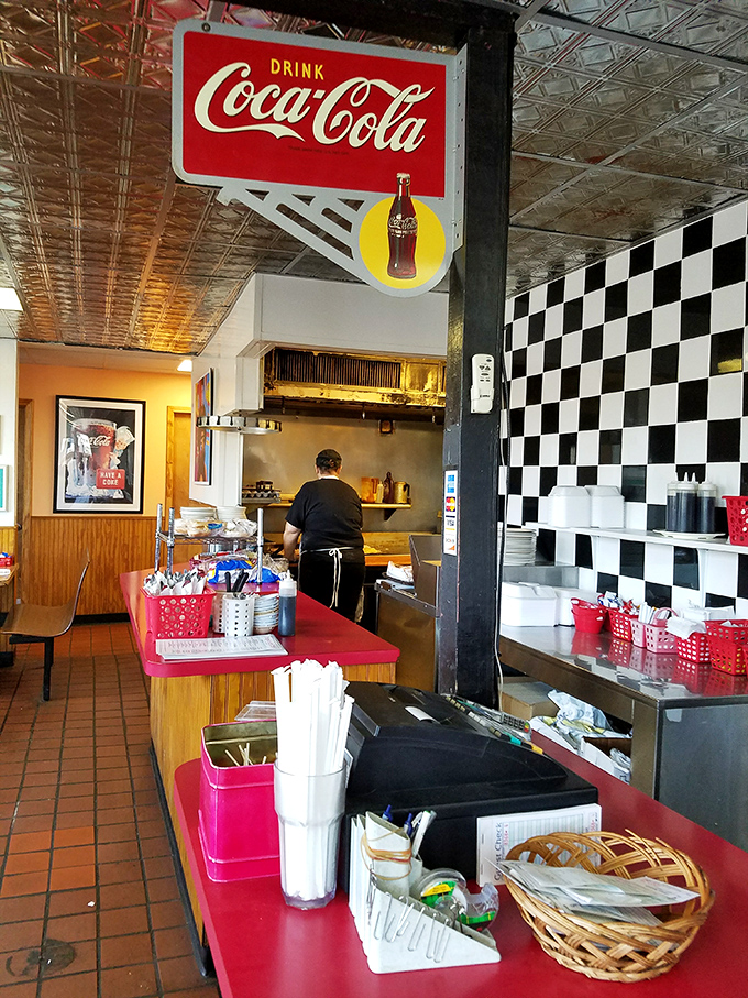 Behind the scenes where breakfast magic happens. That checkered wall has witnessed more egg flips than an Olympic gymnastics competition.