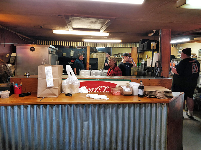 Behind this counter, barbecue magic happens. The corrugated metal front is like a silver curtain before the main event.