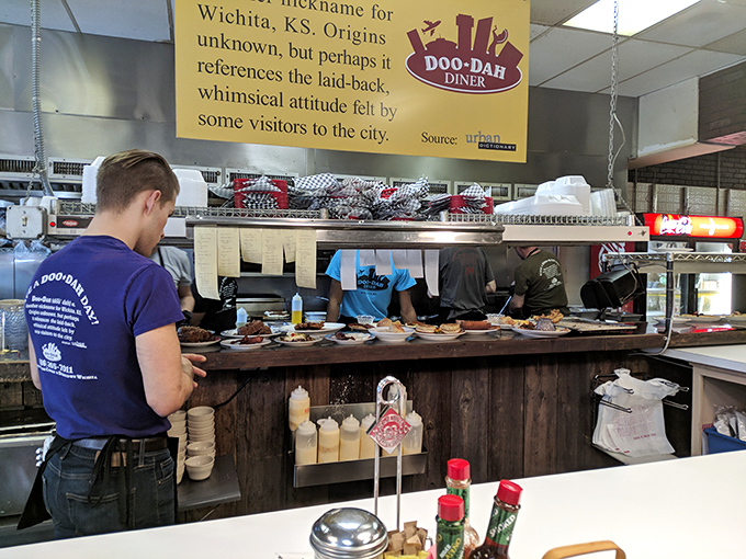 Behind every great breakfast is a kitchen crew working culinary magic. The sign above explains the "Doo-Dah" name&mdash;a nod to Wichita's whimsical spirit.