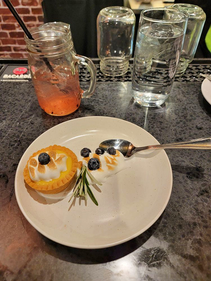 This lemon tart isn't just dessert&mdash;it's edible sunshine. The fresh blueberries and rosemary sprig are like nature's way of saying, "You're welcome."