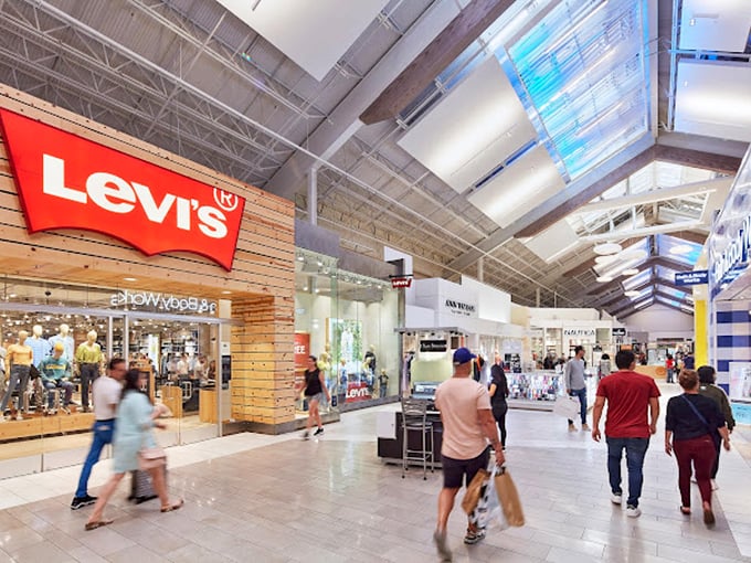 Levi's and its neighbors create a gauntlet of temptation. That high ceiling isn't just architectural&mdash;it's to accommodate all your shopping aspirations.