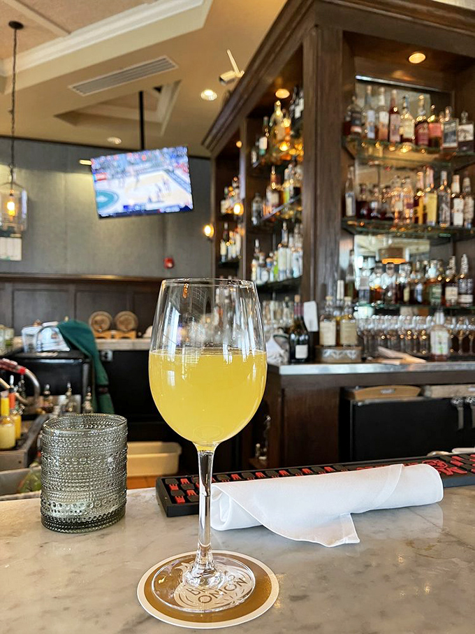 A sunshine-colored mimosa awaits at the marble bar &ndash; weekend vibes in liquid form, regardless of what day it is.