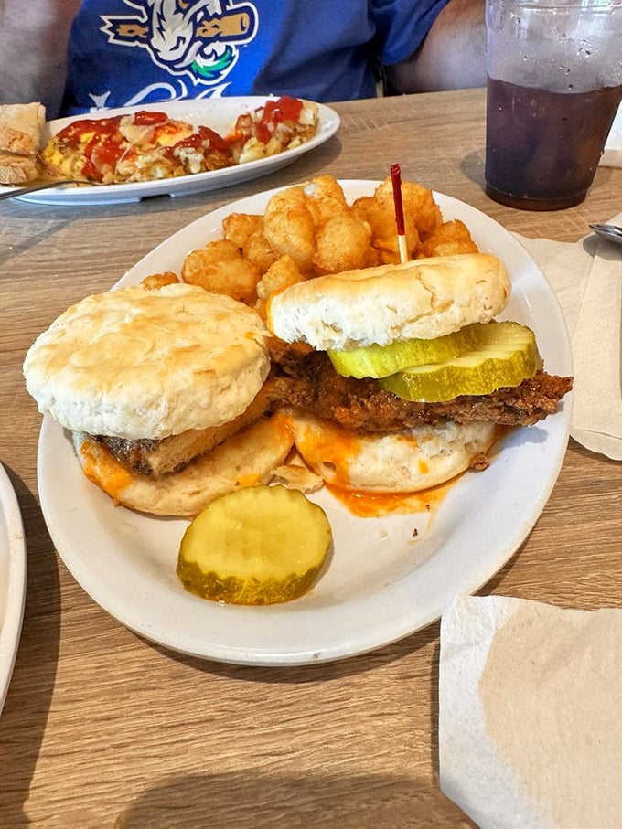 Nashville hot chicken on a biscuit – proof that North meets South in the most delicious peace treaty ever negotiated.