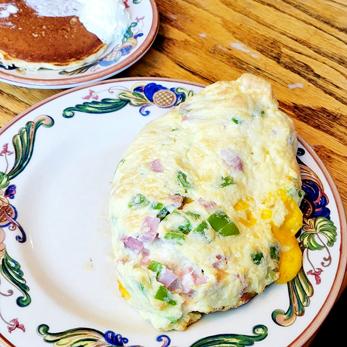 An omelet that's practically bursting with freshness. Perfectly executed with vibrant vegetables and melty cheese&mdash;the breakfast equivalent of a warm hug.