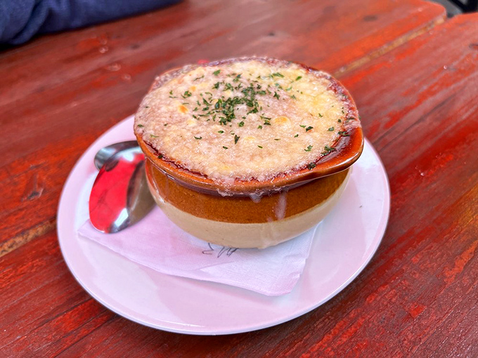 This isn't just soup&mdash;it's a commitment. Beneath that cheesy blanket lies an onion broth that's been simmering its way to perfection.