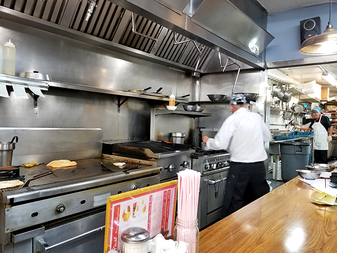 Behold the culinary colosseum where breakfast dreams are born! This open kitchen is where ordinary ingredients transform into extraordinary meals, faster than you can say "Over easy, please!"