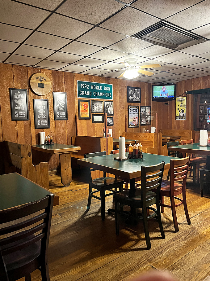 The dining room tells stories through its wood-paneled walls and championship banners&mdash;each table a front-row seat to BBQ history.