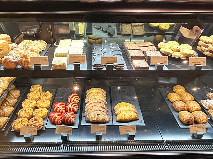 The display case&mdash;a museum of flour and butter where each pastry deserves its own little spotlight and moment of silent appreciation.