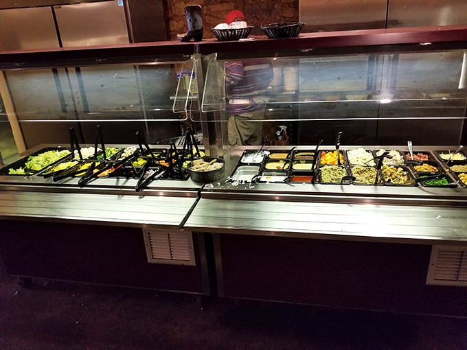 The salad bar offers a rainbow of sides and toppings, though everyone knows it's just a warm-up act for the main event.