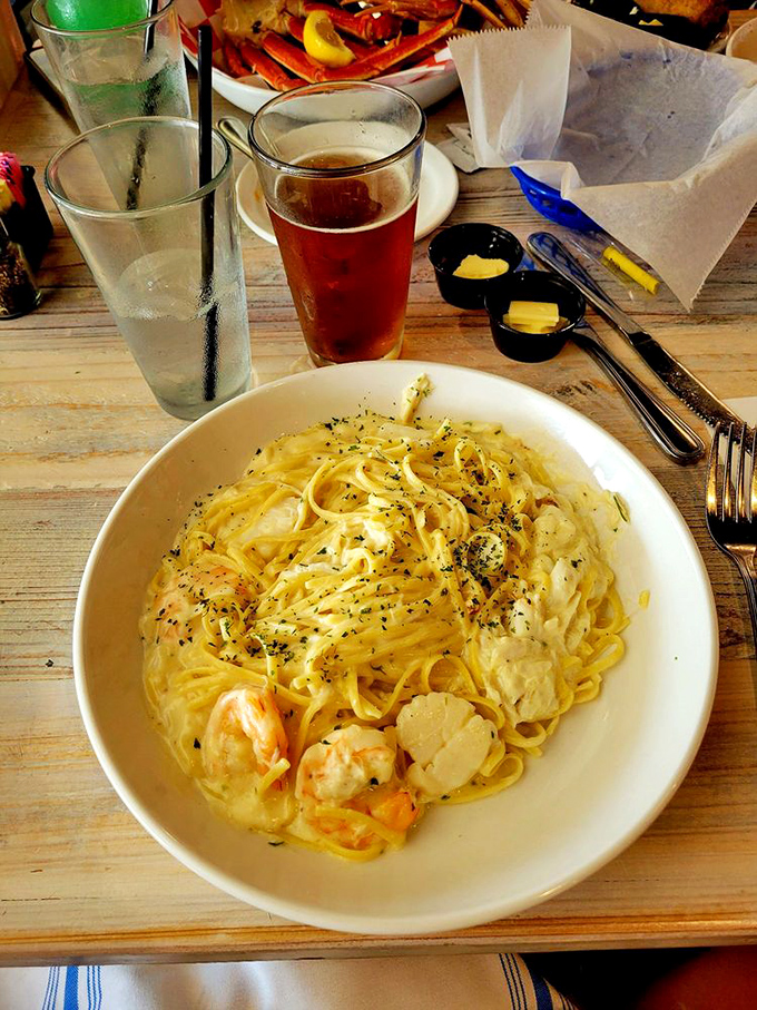 Seafood alfredo that answers the eternal question: "Can pasta actually make you hear ocean waves?" The answer is yes.