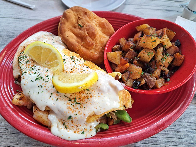 Not just an omelet but a seafood symphony on a red plate. Whoever said breakfast should be boring clearly never ate here.