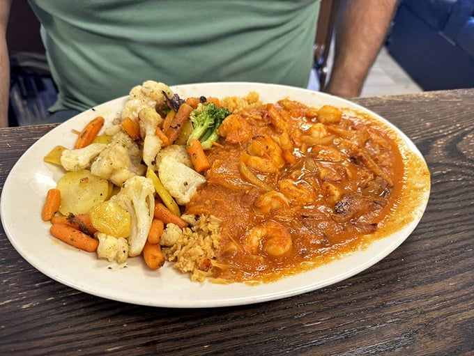 Those shrimp look like they're swimming in a sauce so good you'll want to bottle it. The vegetables add color to this spicy masterpiece.