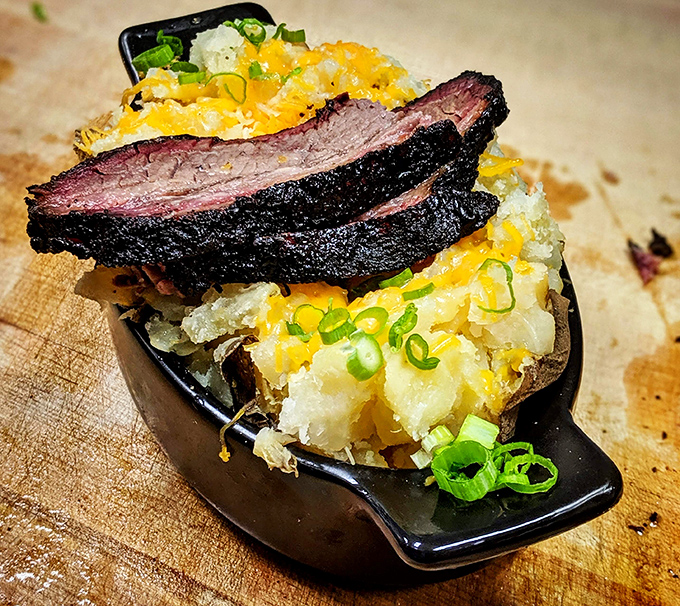 A brisket-topped potato that deserves its own ZIP code. This loaded spud isn't just comfort food &ndash; it's a comfort empire with melty cheese as its crown.