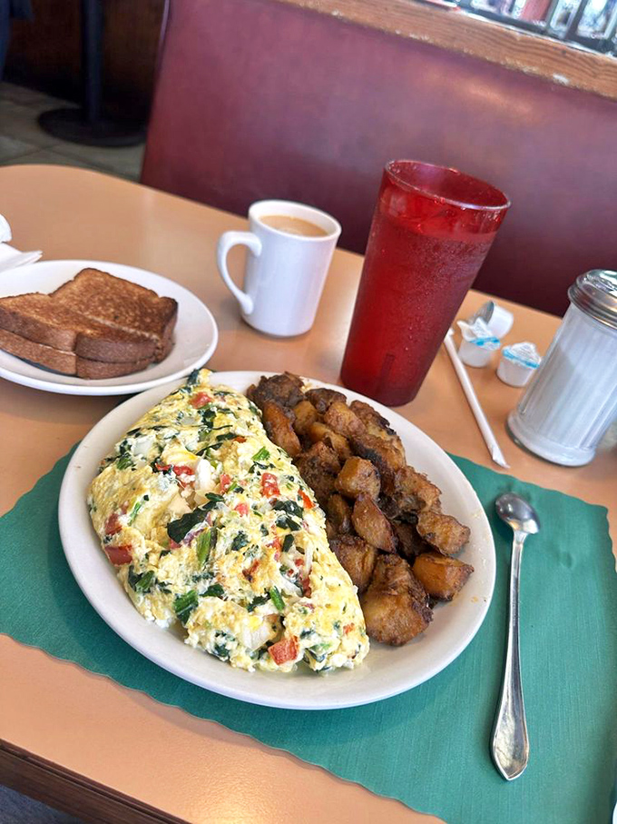 This veggie-packed omelet proves healthy can be decadent. Those home fries aren't just a side&mdash;they're moral support for your day ahead.