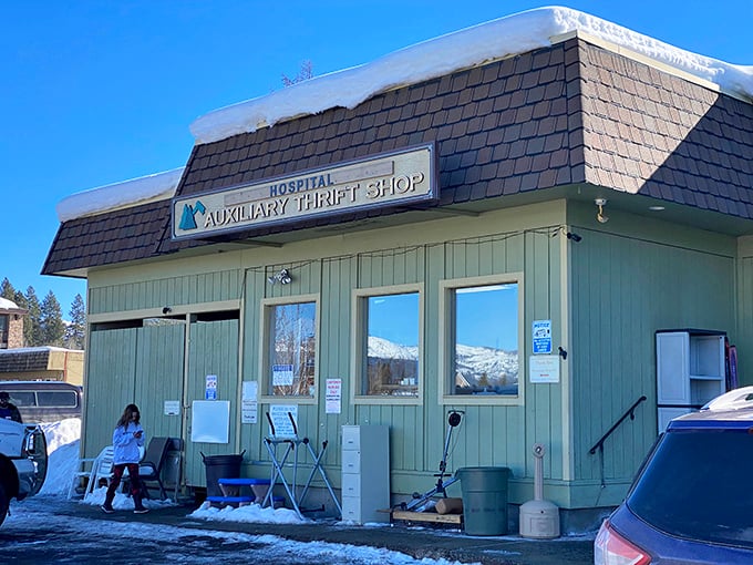 Thrift shop treasures await at St. Luke's Auxiliary, where one person's castoffs become another's conversation piece against a backdrop of snowcapped mountains.