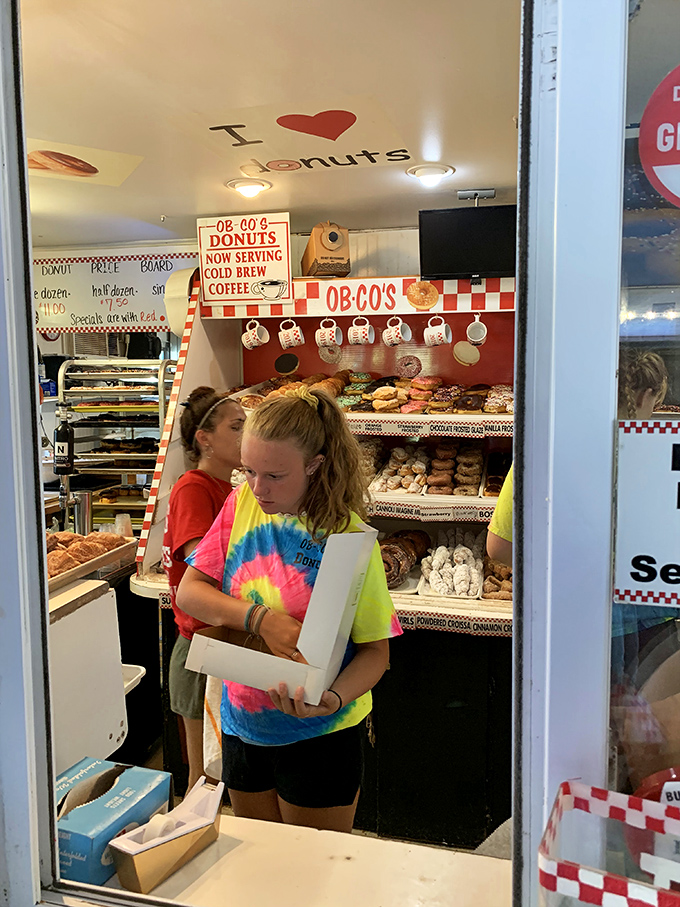 Under the watchful "I &hearts; Donuts" sign, the inner sanctum reveals itself. Like NASA for pastries, precision and passion on full display.