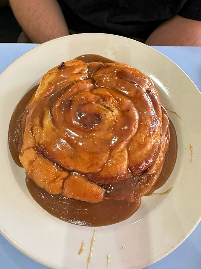 Dripping with gooey goodness- this cinnamon roll is the sweet, sticky hug your taste buds didn't know they needed.