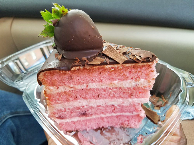 Strawberry cake so pretty it belongs in a museum, though museums frown on people taking bites out of the exhibits.