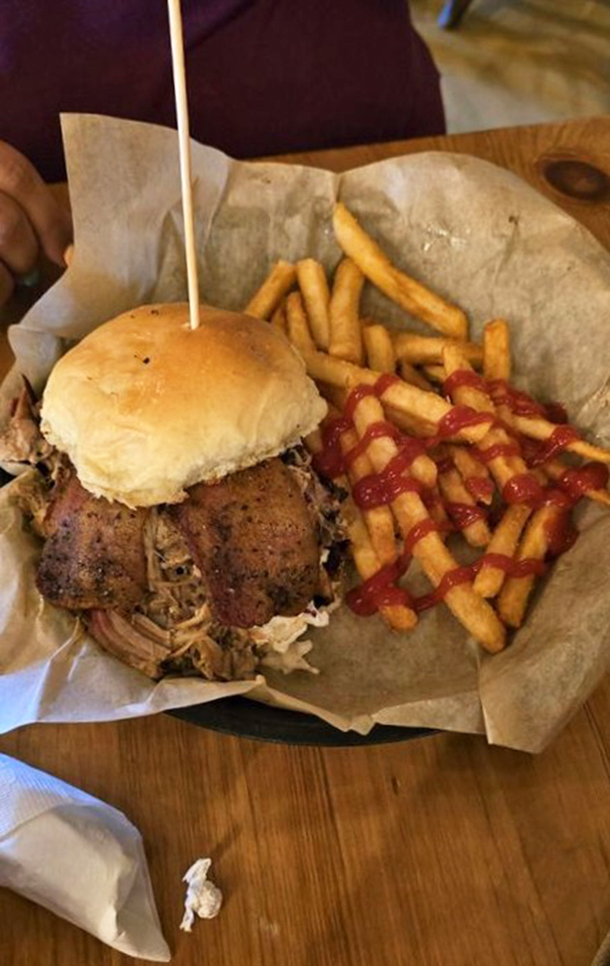 A smokehouse stacker that requires both hands, several napkins, and a moment of silent appreciation before the first magnificent bite.