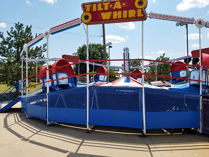 The Tilt-A-Whirl's classic red, white, and blue cars have been testing stomach fortitude and creating dizzy memories for generations of Kansas families.