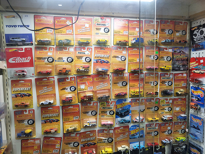 Matchbox memories on display! Each tiny vehicle represents approximately 37 hours of childhood floor time and at least one barefoot parent's midnight scream.