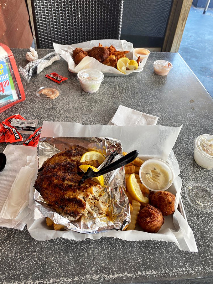 Two seafood baskets, twice the joy. That blackened fish is giving a master class in how to exit the ocean with dignity.
