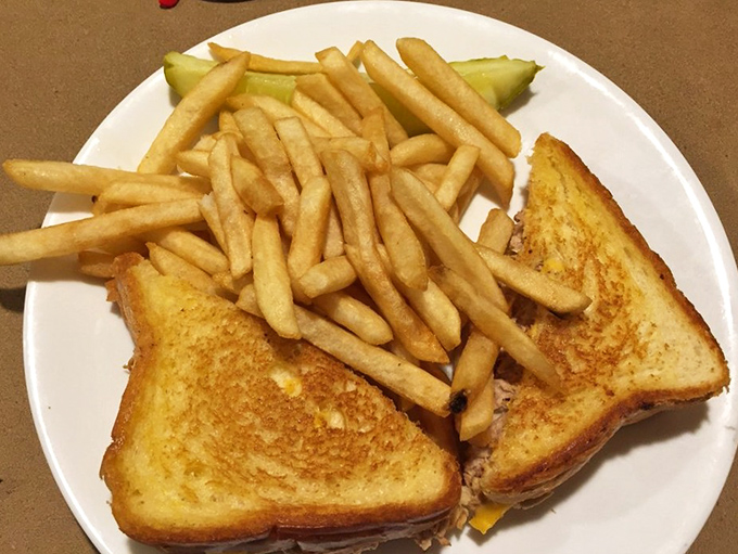 A grilled cheese sandwich with fries&mdash;childhood nostalgia served hot with a side of grown-up satisfaction.