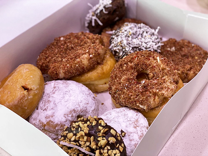 A box of joy in donut form. Like a treasure chest for grown-ups, each unique creation promises its own delicious adventure.