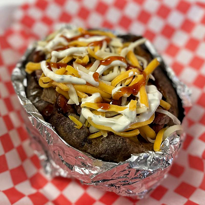 A loaded baked potato dressed for its own special occasion. When cheese, meat, and condiments throw a party on a spud.