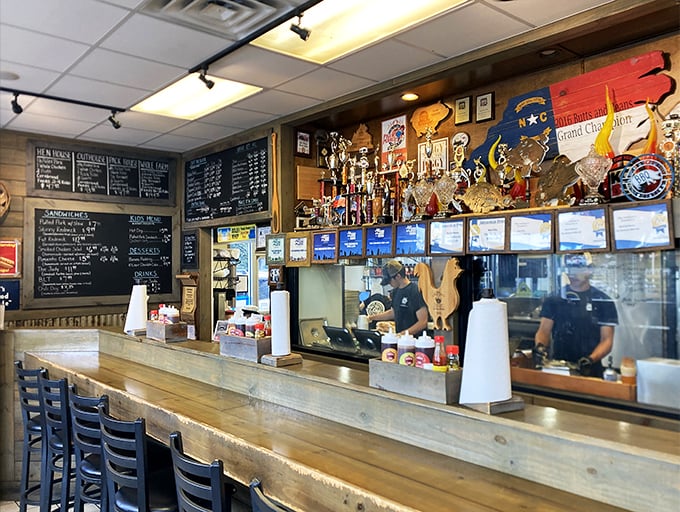 Behind the counter, trophies stand guard over a menu that has converted even the most dedicated Carolina whole-hog traditionalists to brisket believers.
