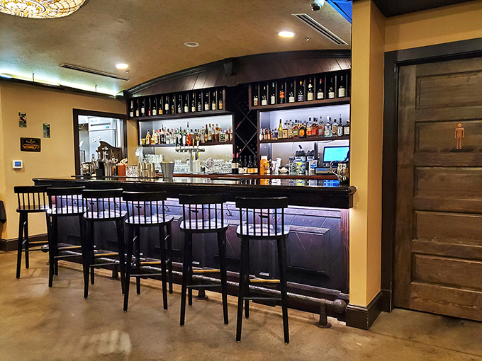 A bar stocked for serious enjoyment—because nothing complements German food like a proper German drink and a stranger becoming your new best friend.