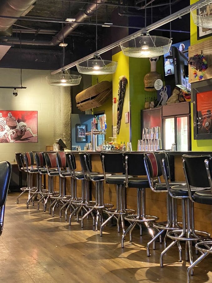 The bar at Zombie Burger: where colorful walls and vintage-style stools create the perfect perch for sipping apocalypse-themed cocktails.