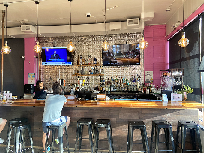 The bar's metallic backdrop and warm wood create the perfect stage for tequila performances that deserve a standing ovation. 
