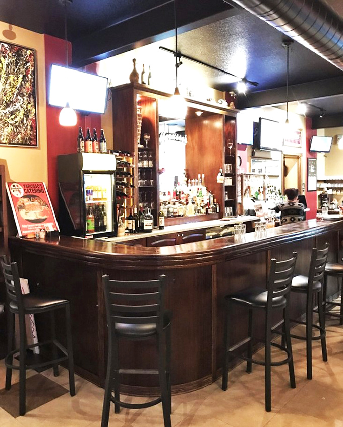 The bar at Yarusso's&mdash;where strangers become friends and friends become family, all over glasses of wine and tales of great meals past.