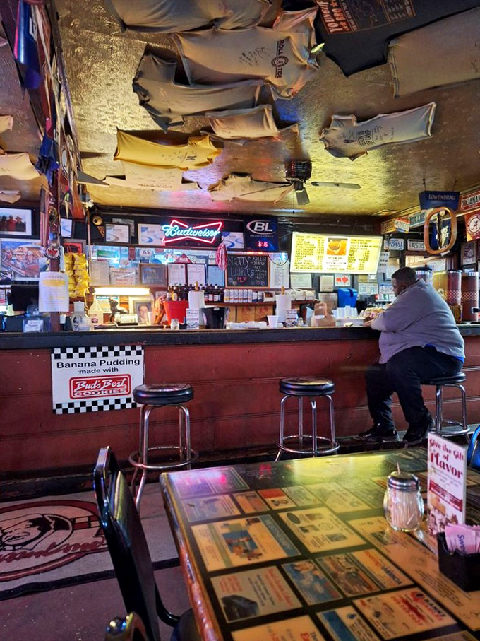 The bar area serves as mission control for barbecue distribution. Those stools have supported some serious eating over the decades.