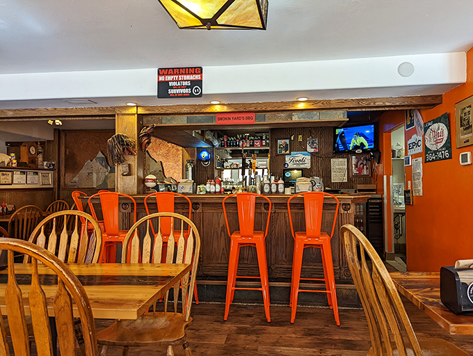 The bar area: where decisions between sauce varieties become life's most important questions. Those orange stools have witnessed many meat-induced epiphanies.