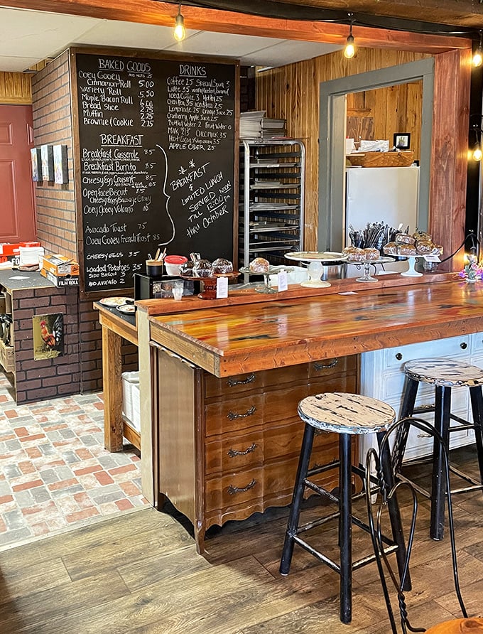 The pastry counter doubles as culinary theater, where glass domes protect their sweet treasures like museum artifacts worth crossing state lines for.