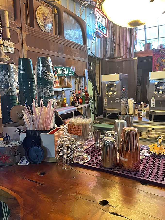 A bar area that looks like it was decorated by someone who never met a vintage sign they didn't like.