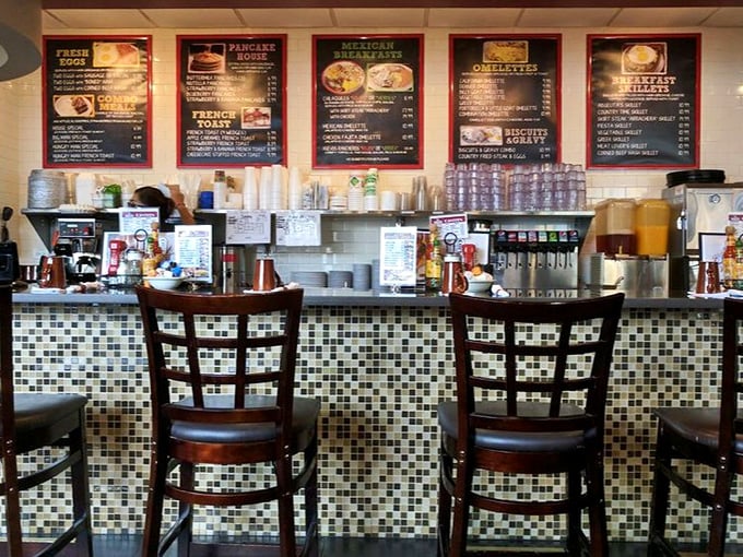 The counter offers front-row seats to the breakfast ballet, where coffee flows and orders fly with choreographed precision.