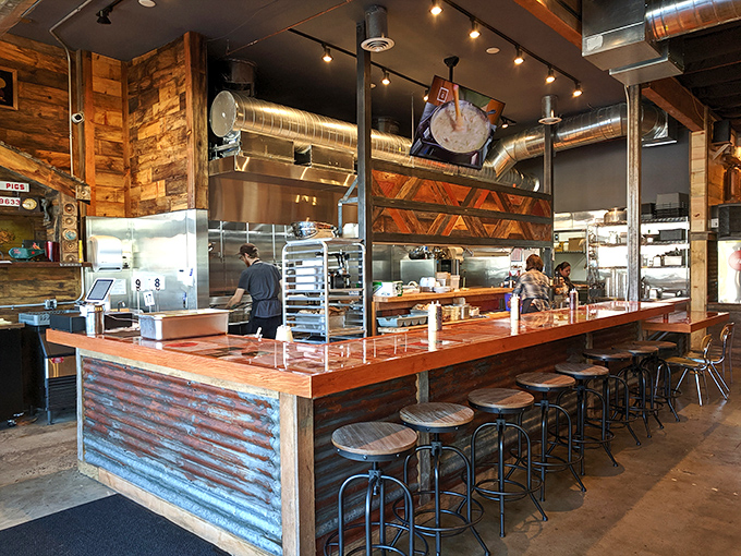 The open kitchen bar seating offers dinner and a show&mdash;watch the culinary choreography that transforms humble chicken into Portland legend. 