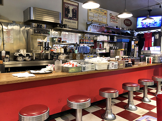 The counter seats offer front-row tickets to the breakfast theater, where short-order cooks perform their morning magic with practiced precision.