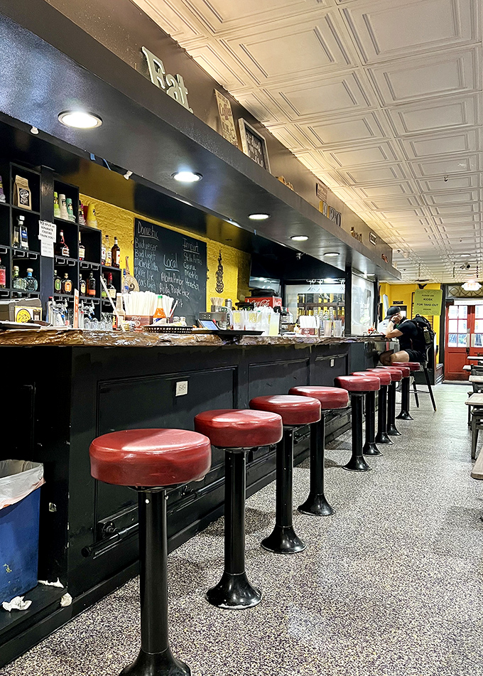 Those red counter stools have heard more New Orleans stories than most tour guides&mdash;pull up a seat and add yours.