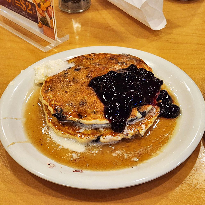 Blueberry pancakes swimming in maple syrup and nostalgia&mdash;breakfast that tastes like your childhood dreams, only better because you're an adult now. 