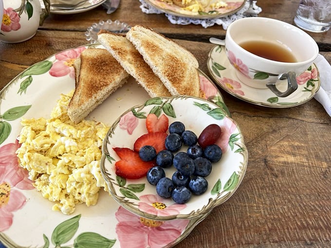 The breakfast trinity: perfectly scrambled eggs, golden toast, and fresh berries&mdash;proof that mornings at The Hatter Caf&eacute; are worth waking up for.