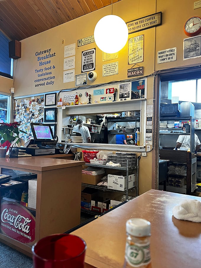Where breakfast magic happens. The wall of humorous signs tells you everything about Gateway's philosophy: good food, zero pretension.