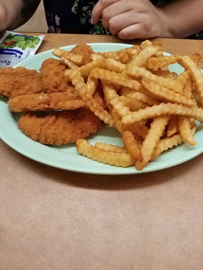Chicken tenders and fries: proving that sometimes the "kid's menu" contains the wisdom we spend adulthood trying to rediscover.