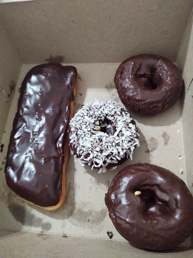 Chocolate donuts that would make Willy Wonka jealous. The coconut-topped one is practically begging to be your new best friend.